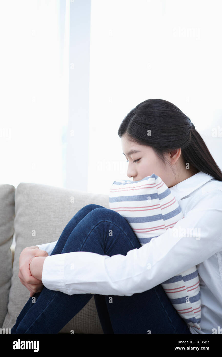 Side view of gloomy middle school girl Stock Photo - Alamy