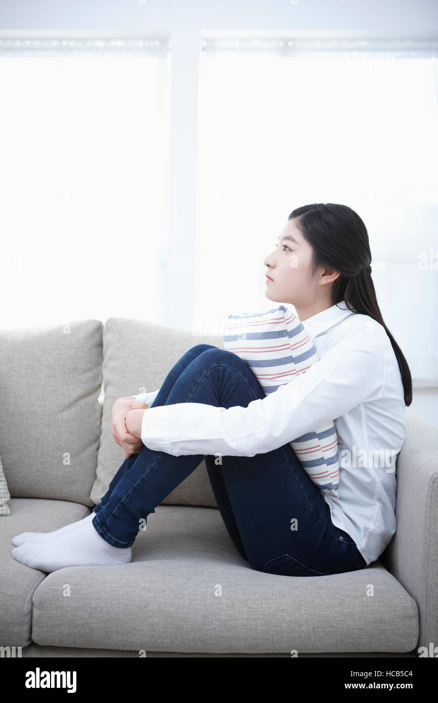 Side view of gloomy middle school girl Stock Photo - Alamy