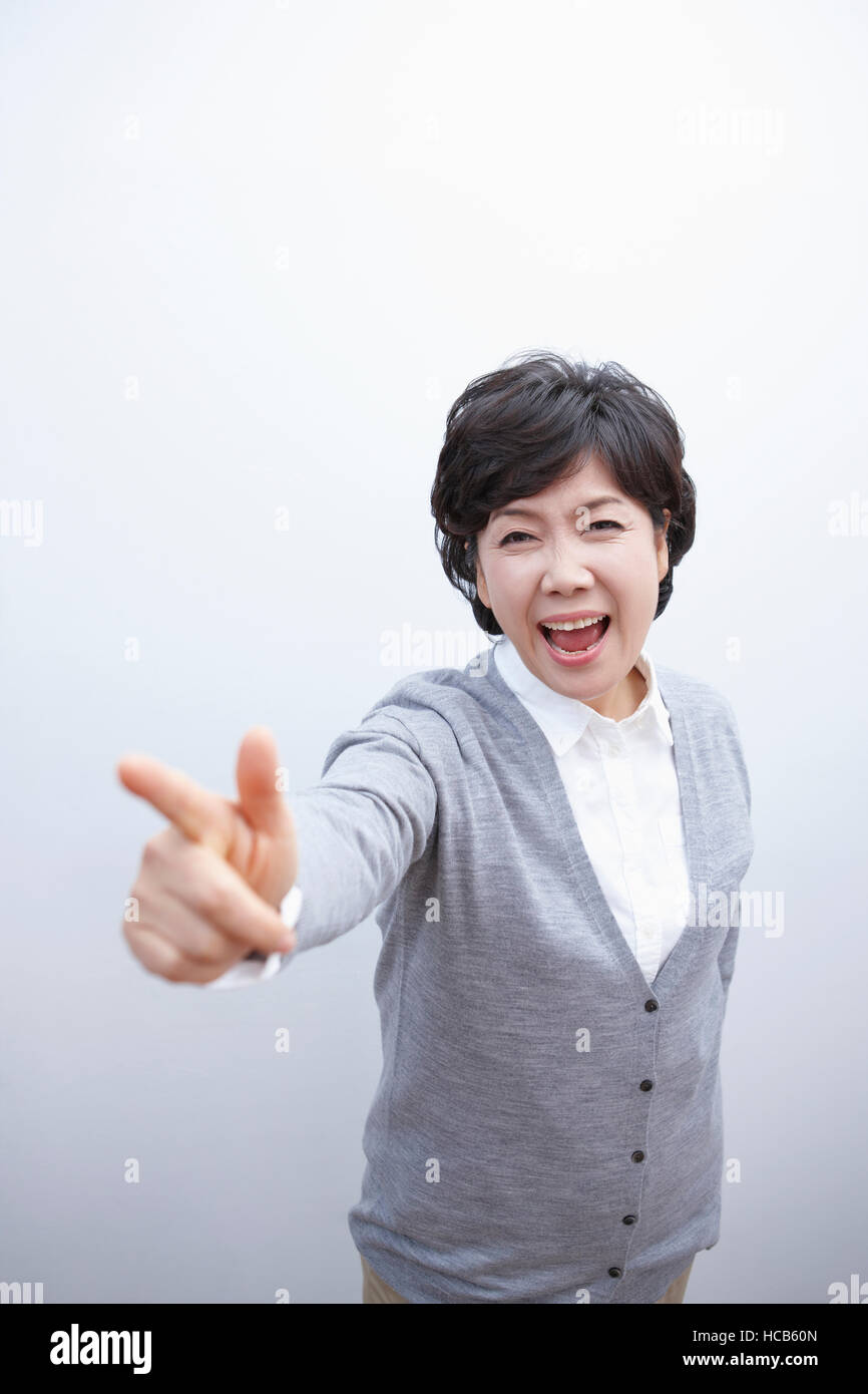 Middle aged woman scolding Stock Photo - Alamy