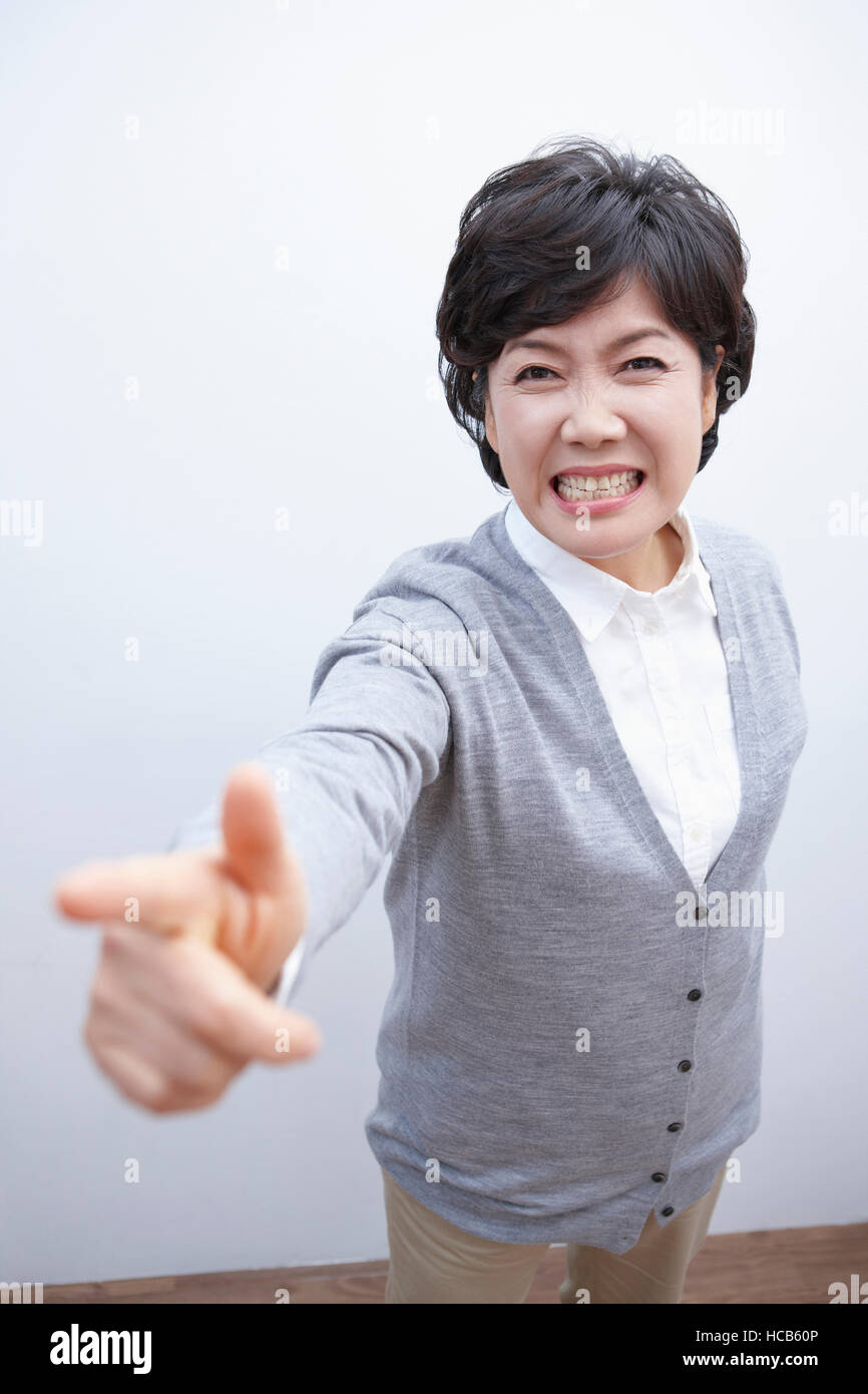 Middle aged woman scolding Stock Photo - Alamy