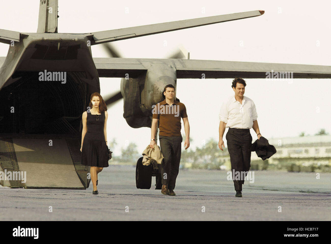 THE DEBT, from left: Jessica Chastain, Sam Worthington, Marton Csokas ...