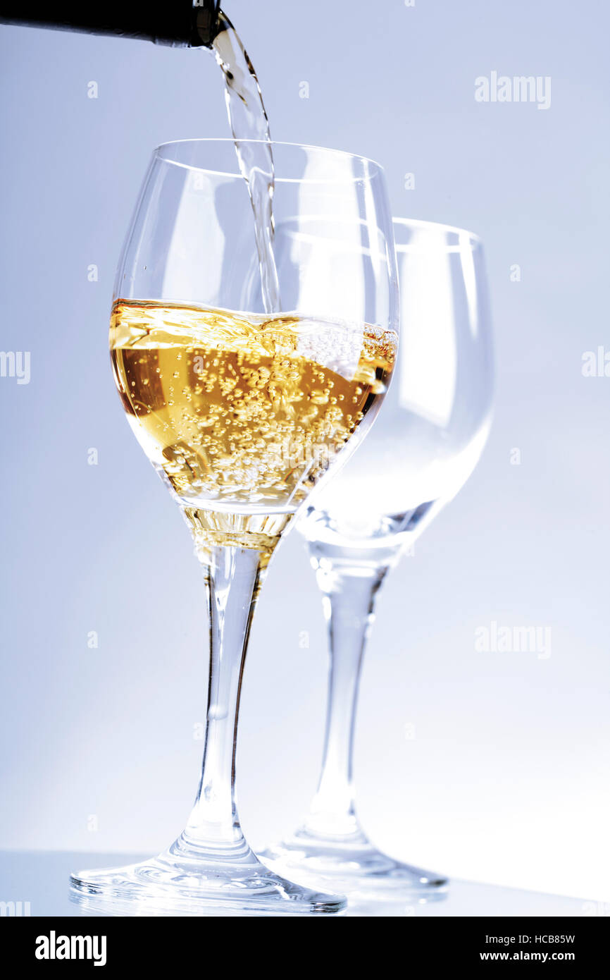 White wine being poured Stock Photo - Alamy