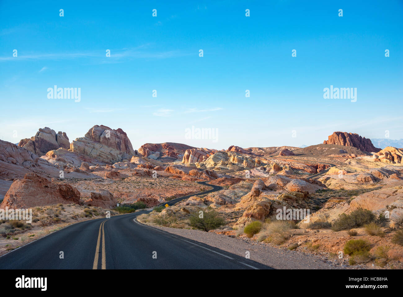 Road between red sandstone formations, Valley of Fire, Mojave Desert ...