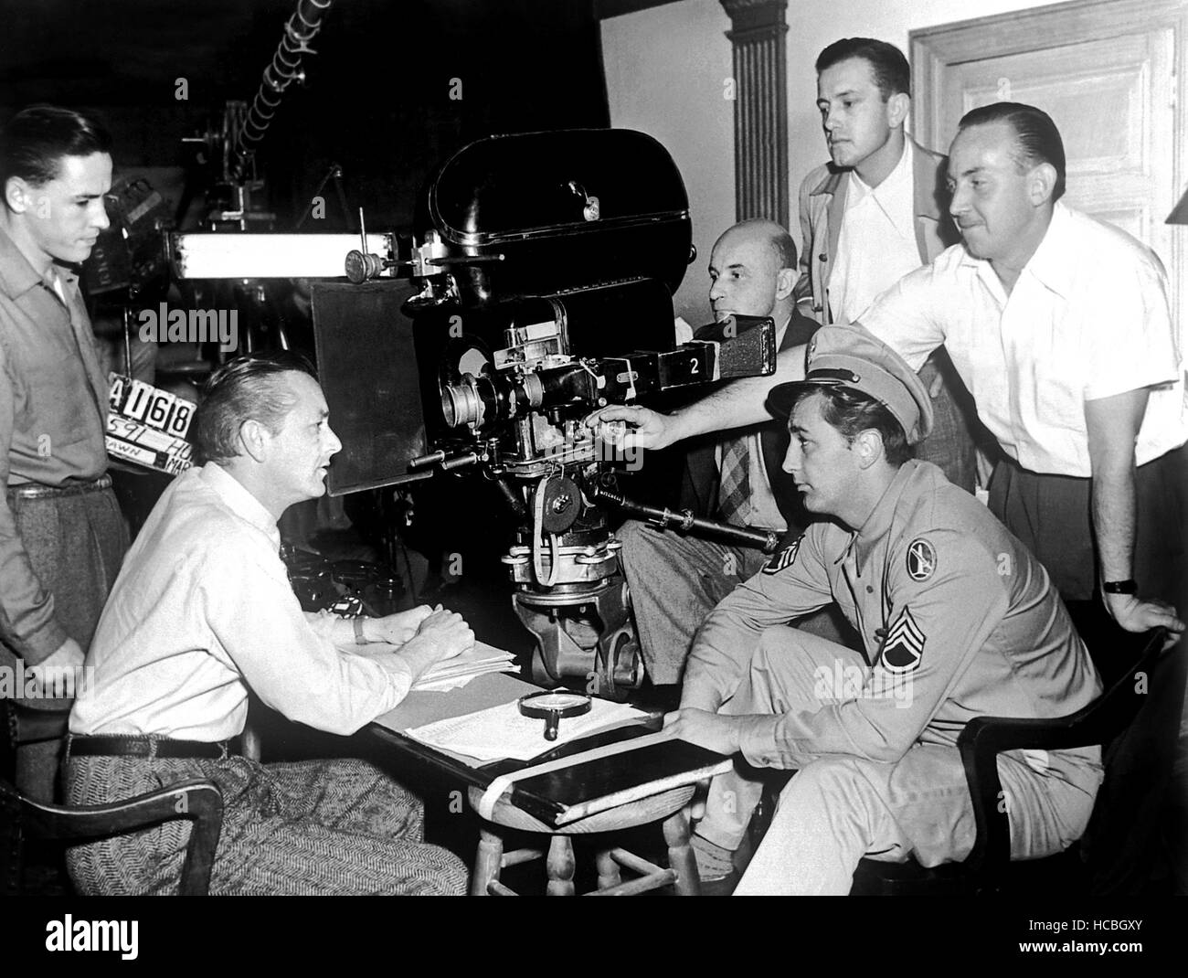 CROSSFIRE, Robert Young, Robert Mitchum, director Edward Dmytryk ...