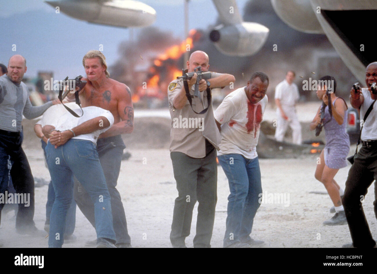 CON AIR, Conrad Goode (blonde hair), John Malkovich (center, with gun ...