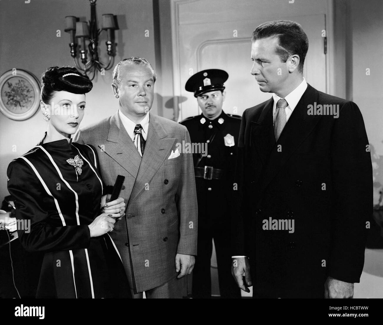 CORNERED, front from left: Nina Vale, Steven Geray, Dick Powell, 1945 Stock Photo - Alamy