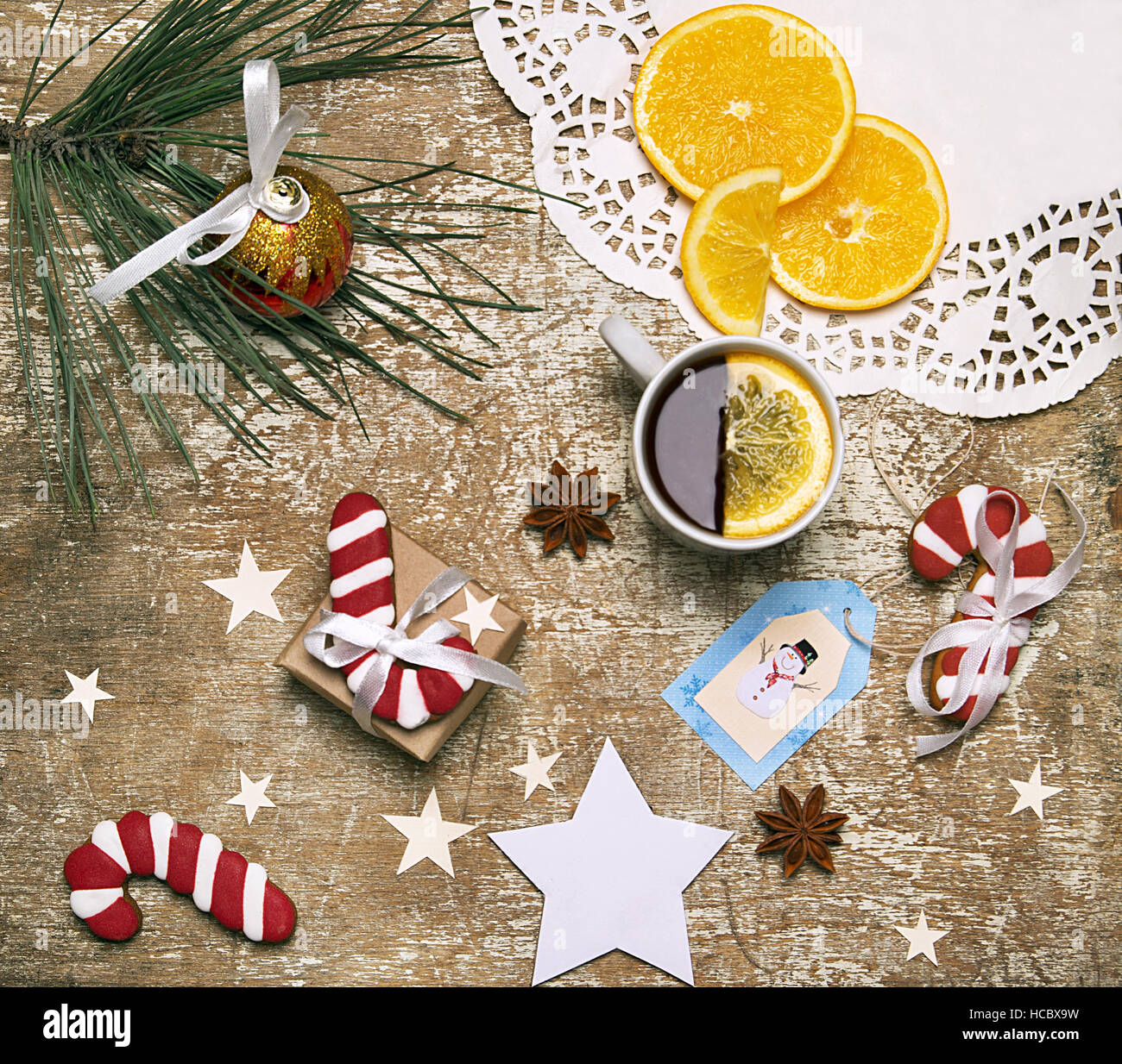 Cup of tea with lemon, candy canes and New Year's Day gifts Stock Photo ...