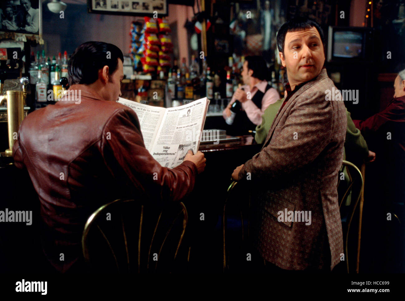 DONNIE BRASCO, Johnny Depp (reading newspaper), Bruno Kirby (looking ...