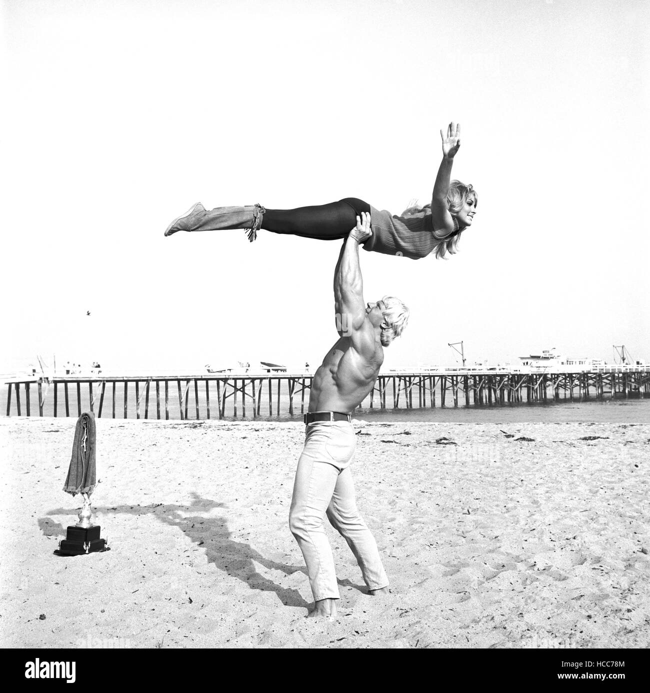 DON'T MAKE WAVES, David Draper lifting Sharon Tate on the beach on set ...