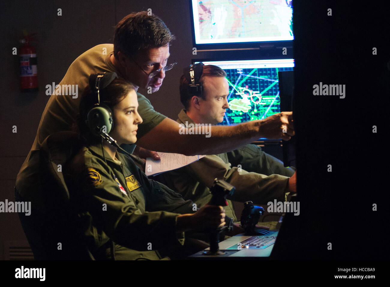 EYE IN THE SKY, from left: Phoebe Fox, director Gavin Hood, Aaron Paul ...