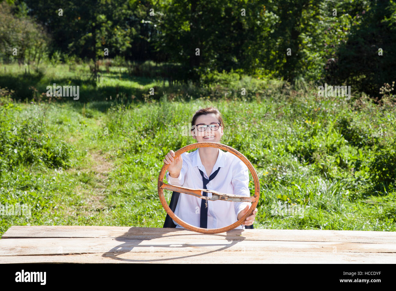 business woman sitting behind the wheel of an imaginary car Stock Photo ...