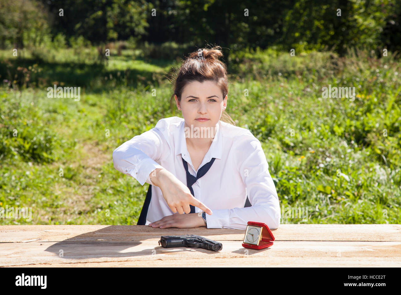 business woman pointing at the clock Stock Photo - Alamy