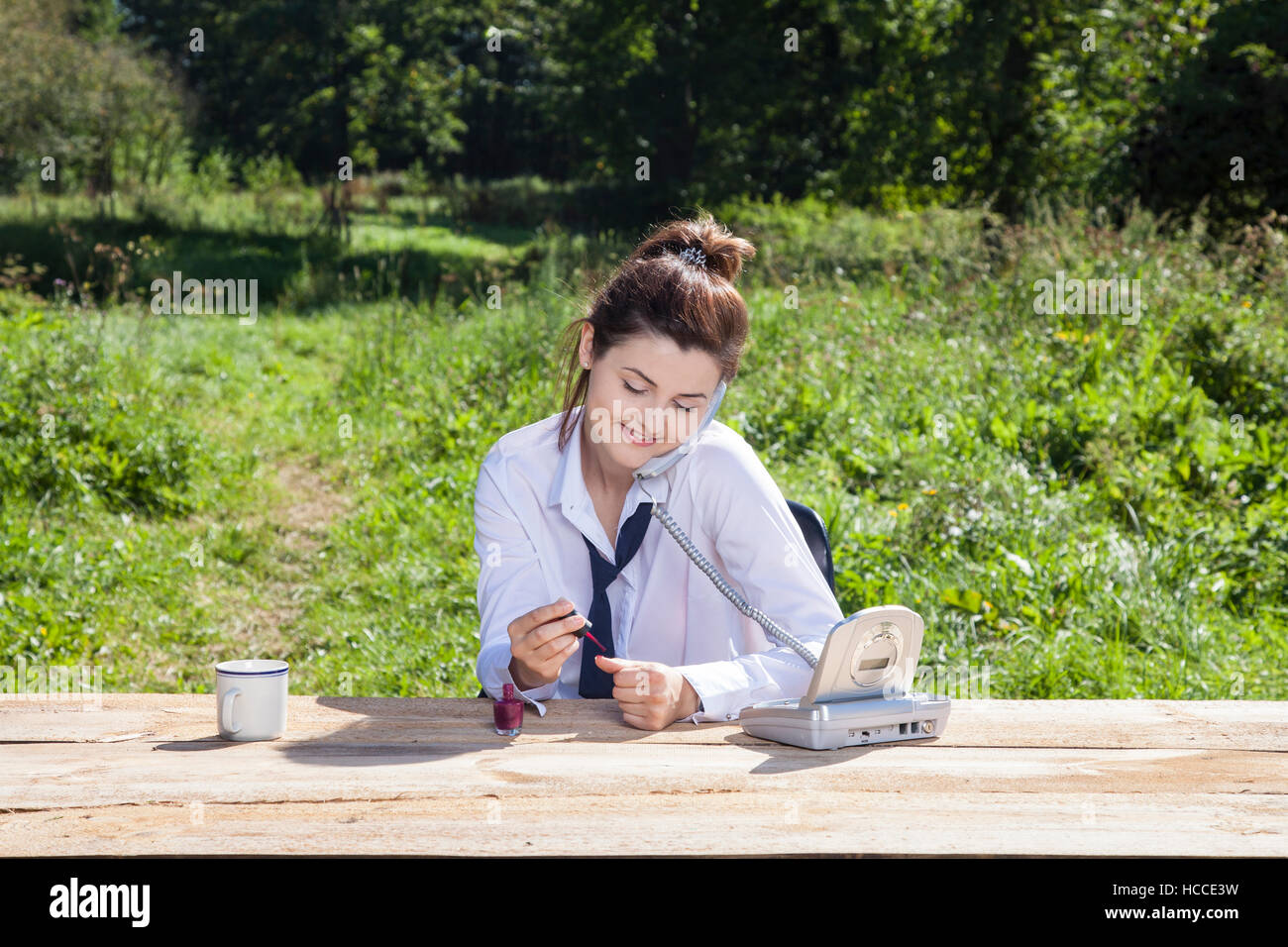 secretary painted nails in the office Stock Photo - Alamy