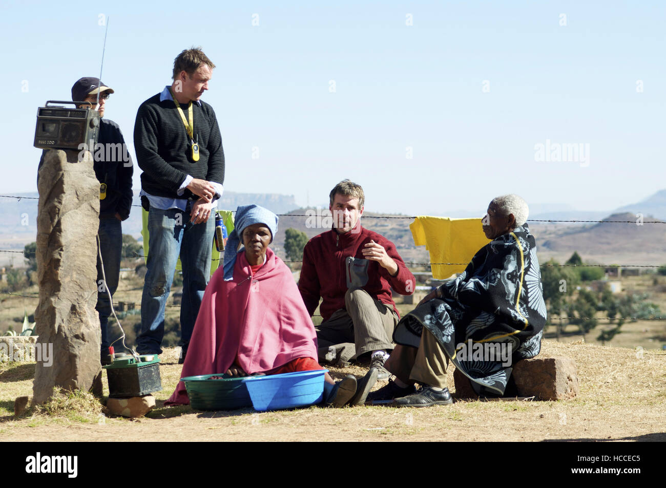 THE FORGOTTEN KINGDOM, Andrew Mudge (in red), on set, 2013 Stock Photo ...