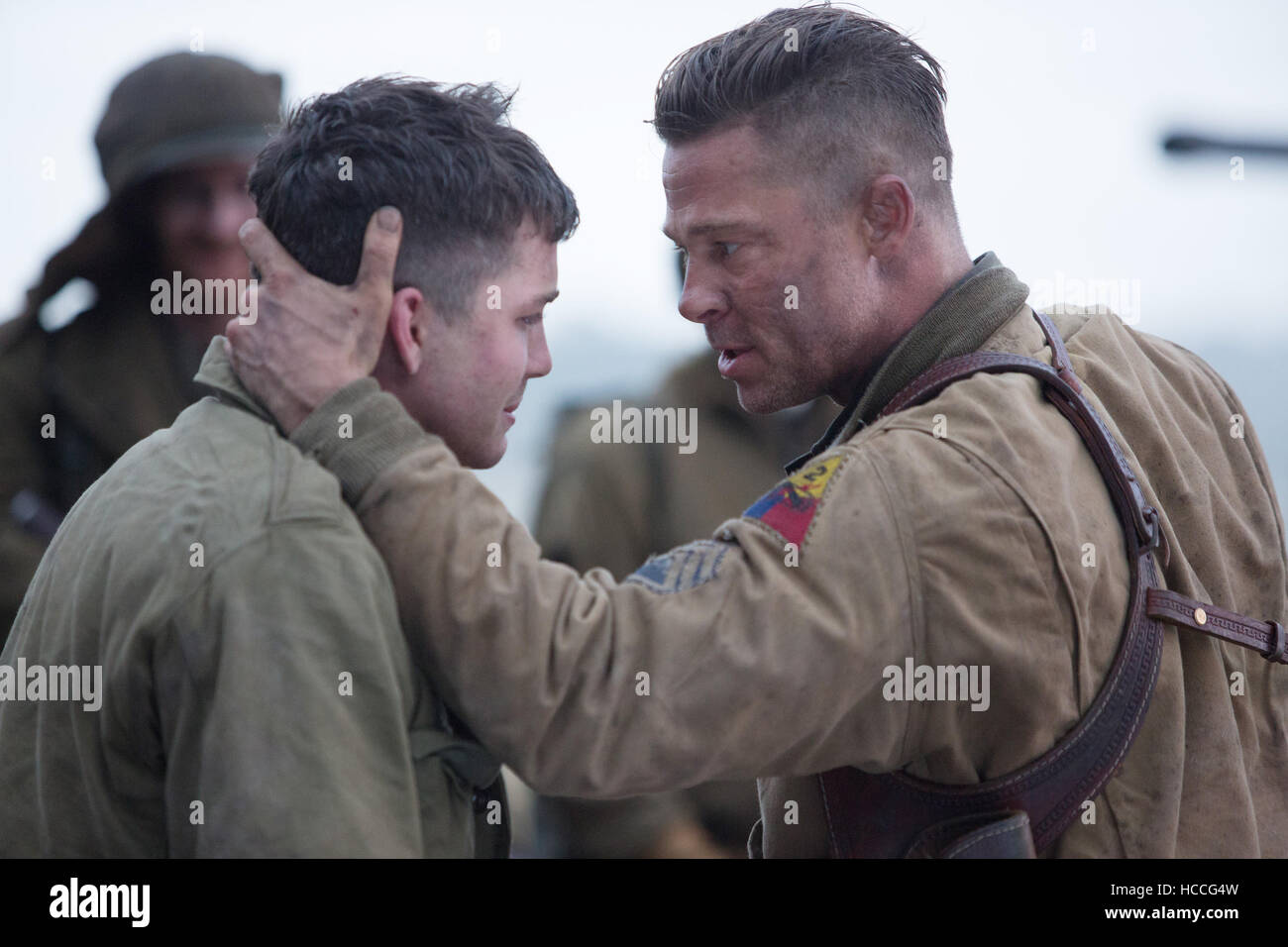 FURY, from left: Logan Lerman, Brad Pitt, 2014. ph: Giles Keyte ...