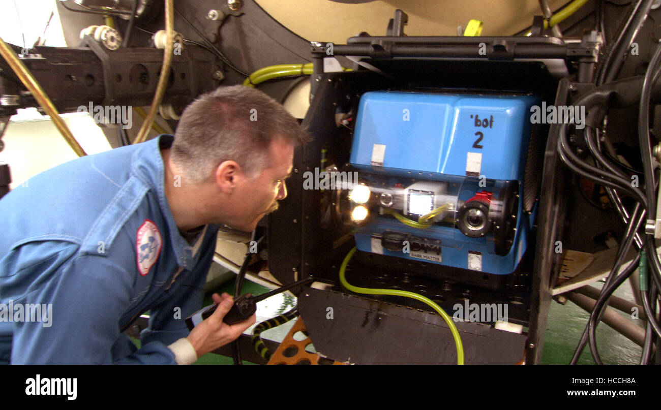 GHOSTS OF THE ABYSS, ROV creator Mike Cameron inspecting a robot that's ...