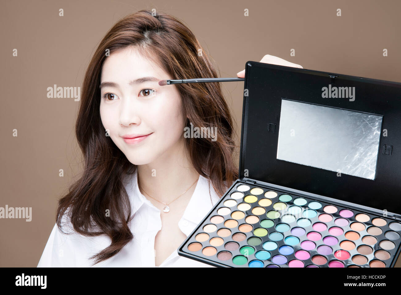 Portrait woman putting on medical hi-res stock photography and images - Alamy