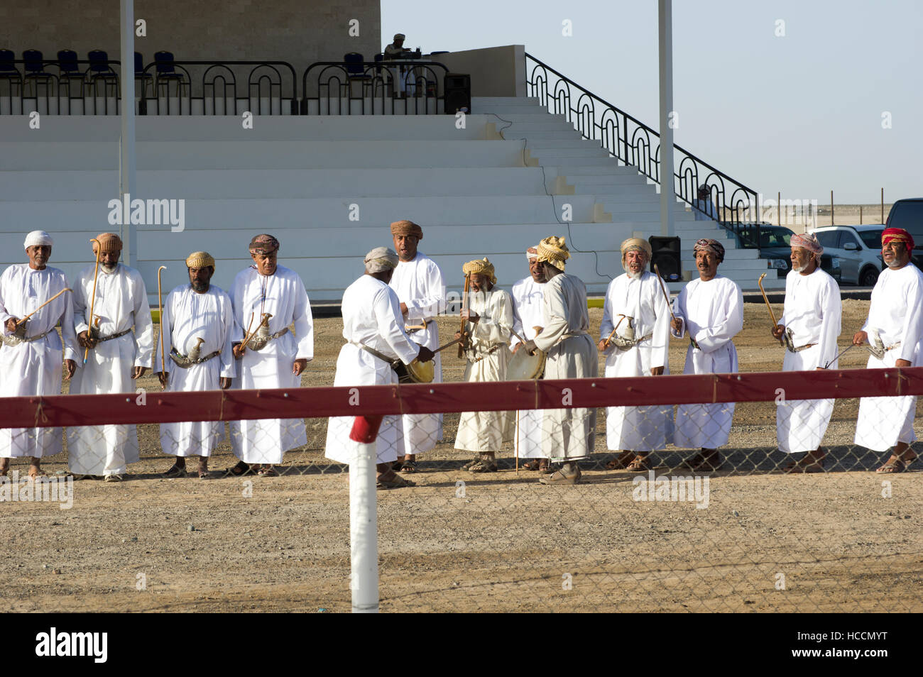 Musicians playing and singing traditional Omani music with instruments ...
