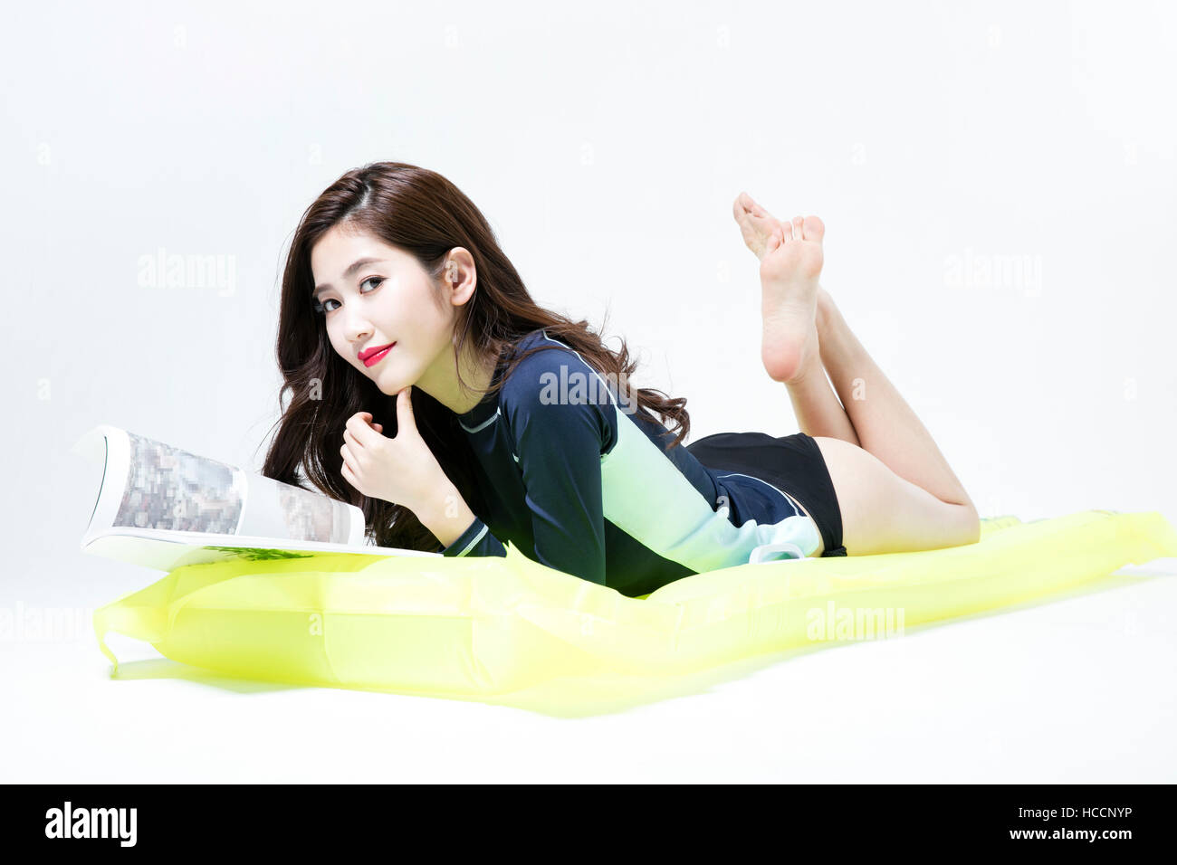 Woman reading lying on hi-res stock photography and images - Alamy