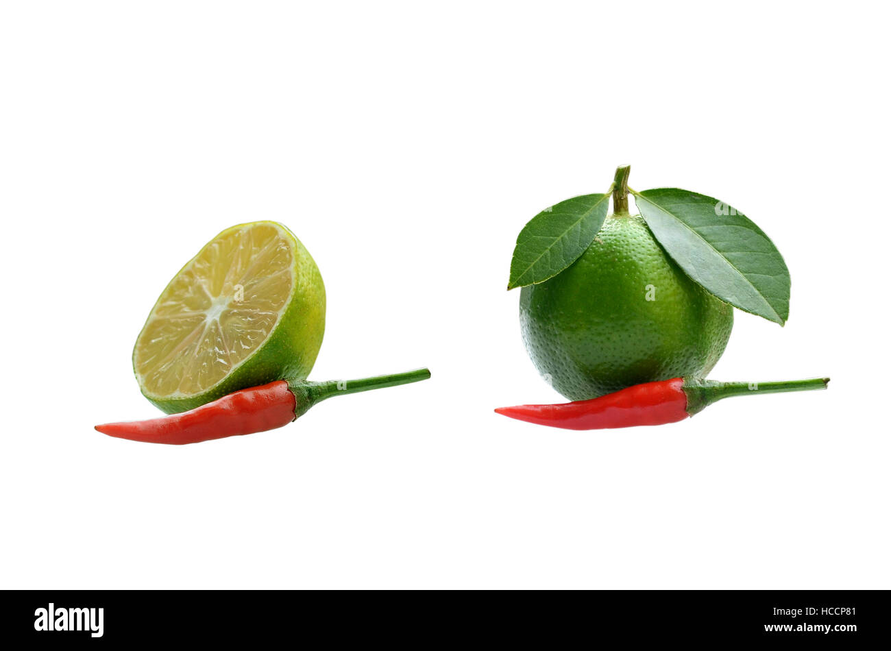 Green lemon and chili isolated on white background Stock Photo - Alamy