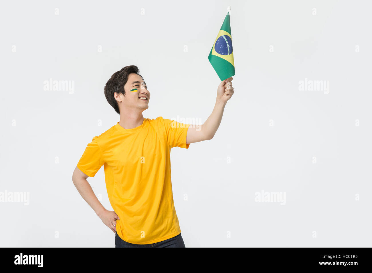 Young asian man flag hi-res stock photography and images - Alamy