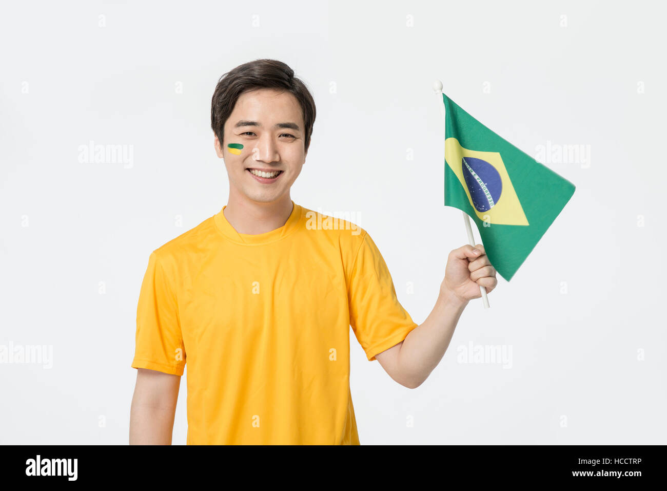 Portrait of young smiling man with flag Stock Photo - Alamy