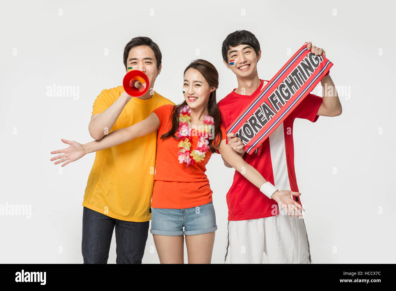 Young smiling people cheering for Korean team Stock Photo - Alamy