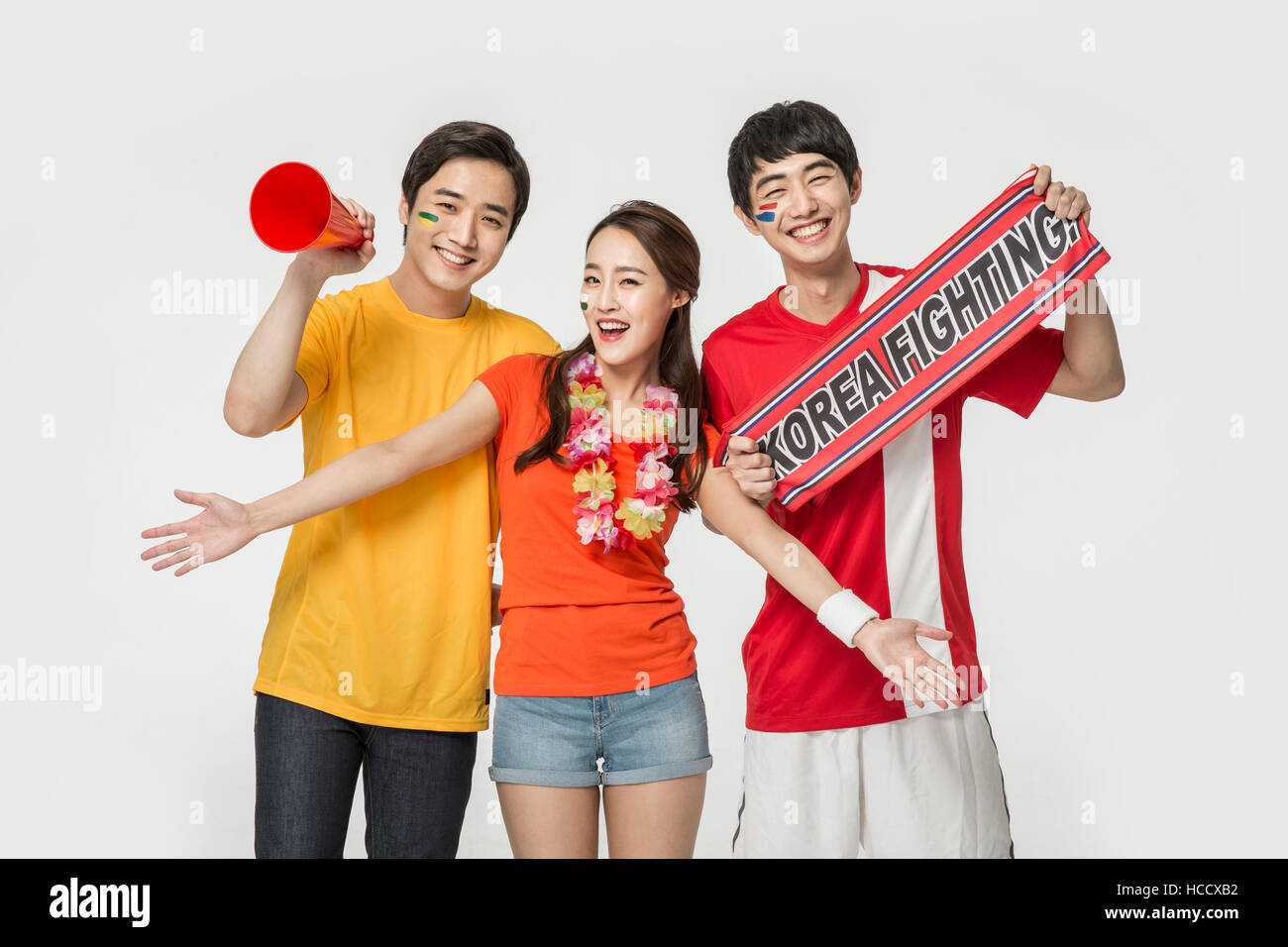 Young smiling people cheering for Korean team Stock Photo - Alamy