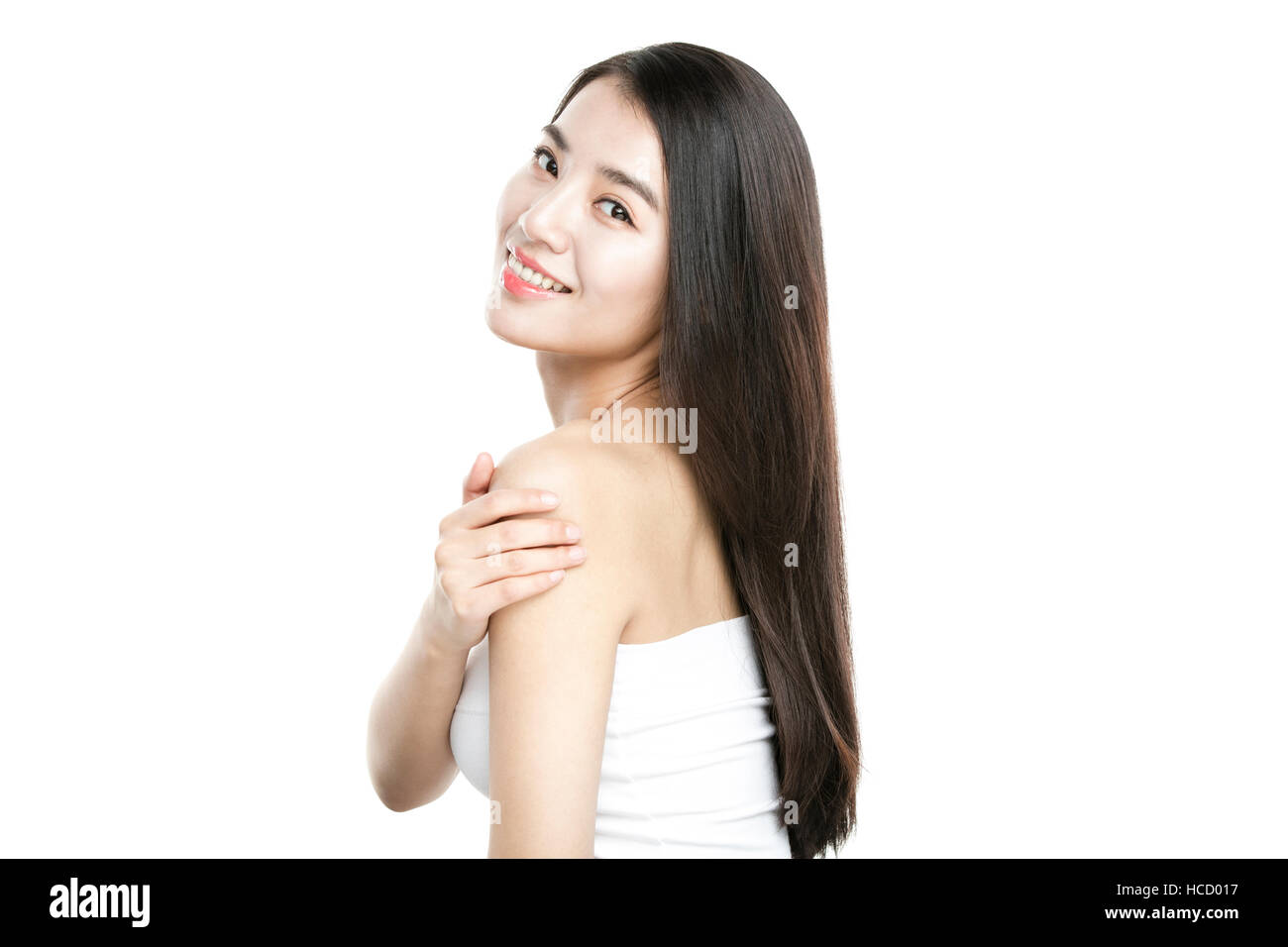 Side view of young smiling woman with long straight hair Stock Photo ...