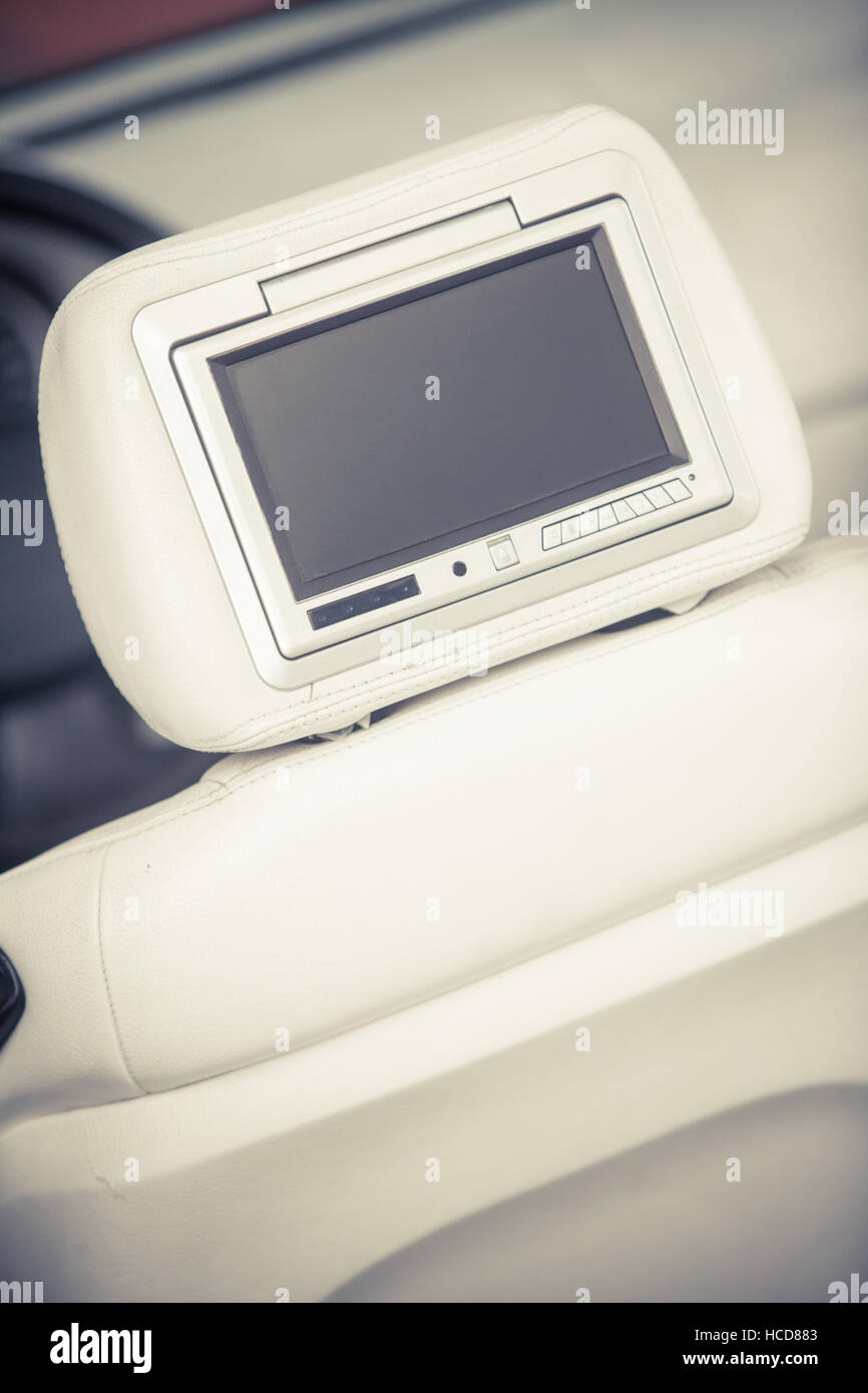 Close up shot of a small screen dvd player inside a car Stock Photo - Alamy
