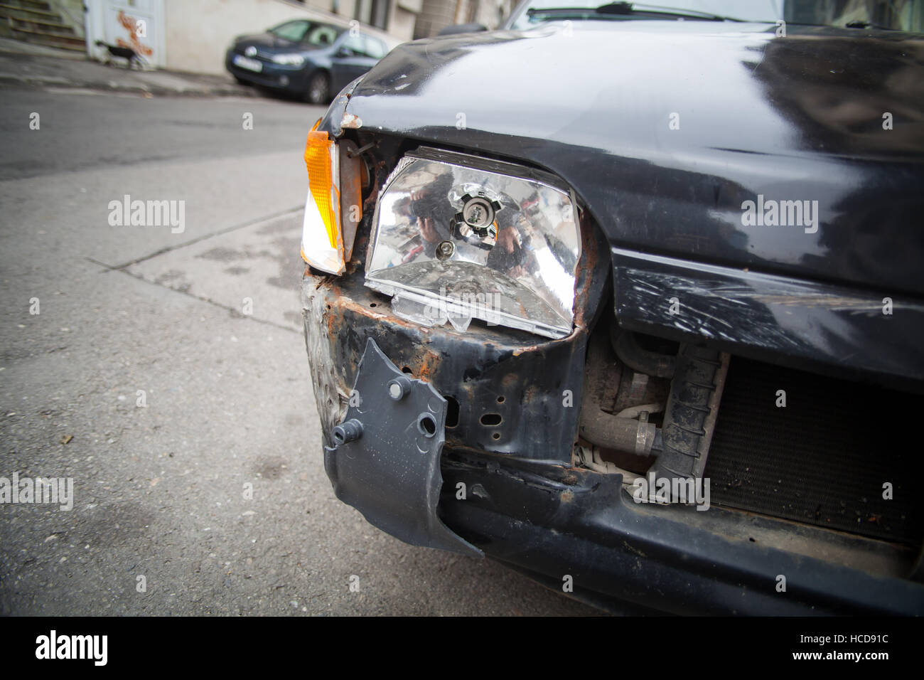 Color image of a crashed car with broken headlight Stock Photo - Alamy