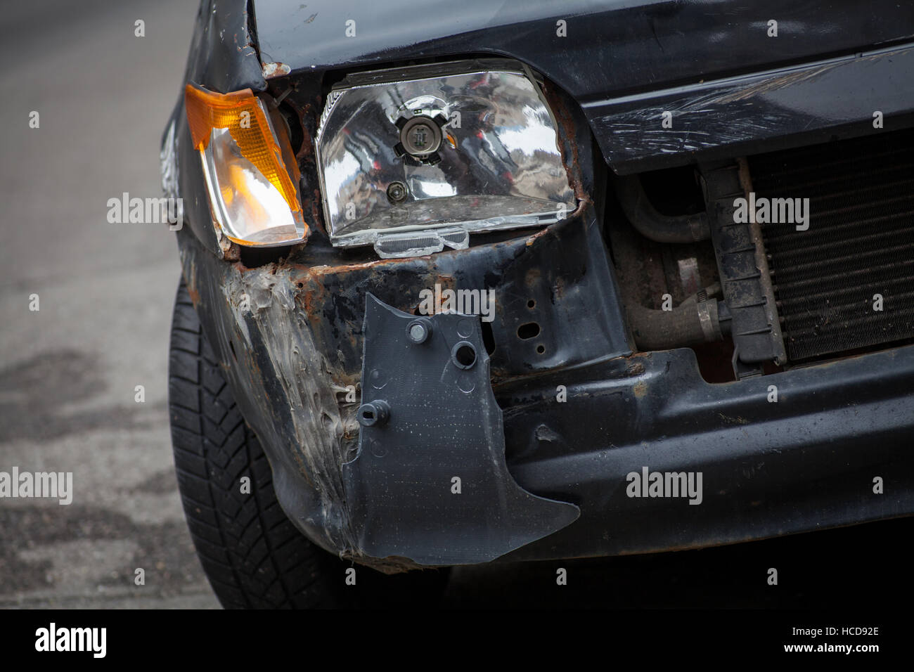 Color image of a crashed car with broken headlight Stock Photo - Alamy