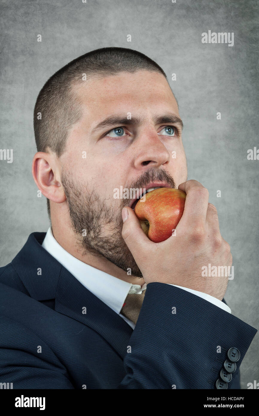 businessman eating an apple Stock Photo - Alamy