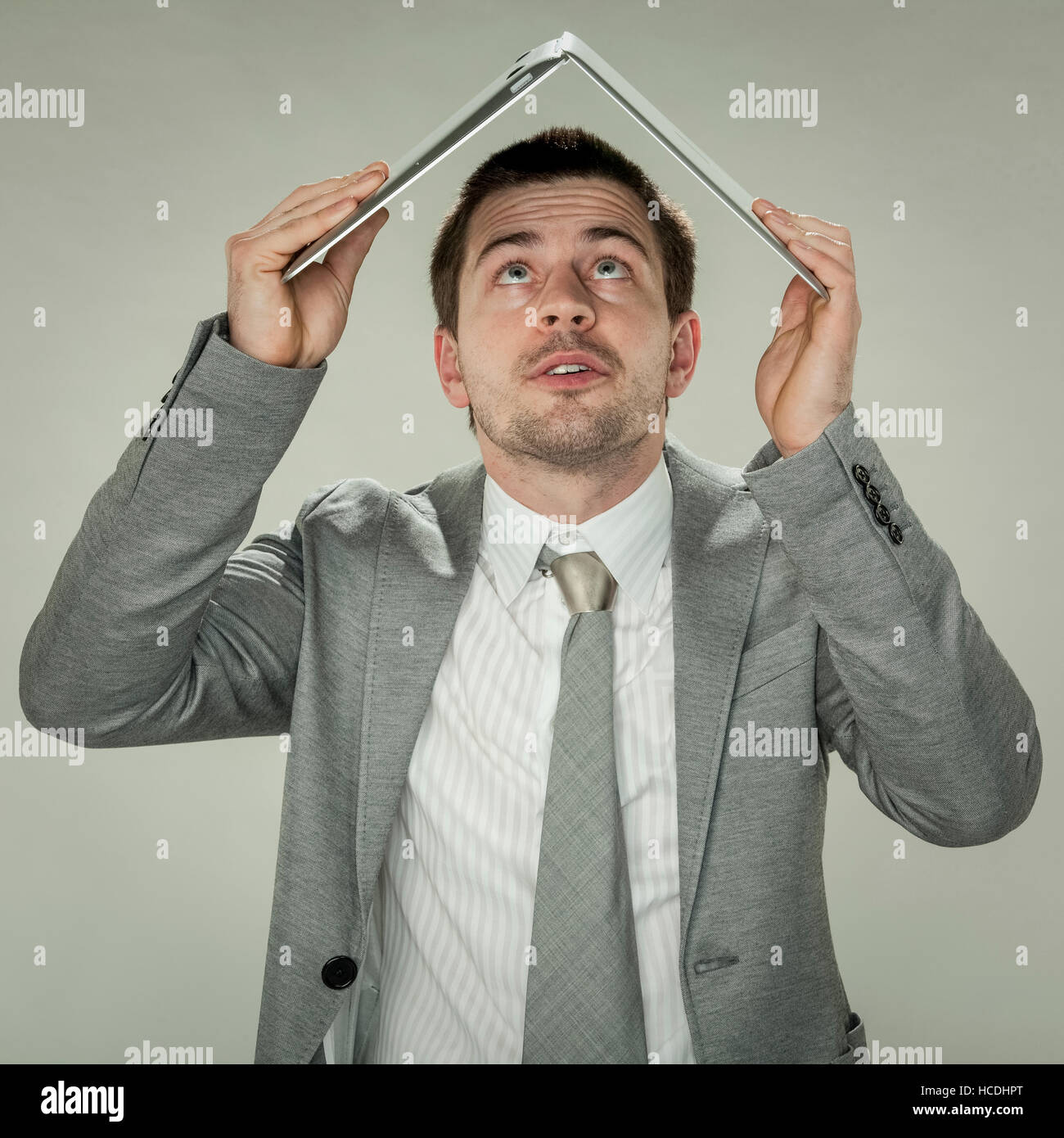 hide under the laptop Stock Photo - Alamy