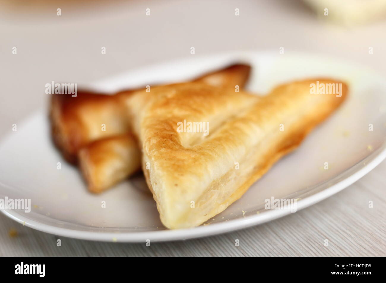 Freshly baked triangle puff pastries. Making Chicken, Cheese and Leek ...