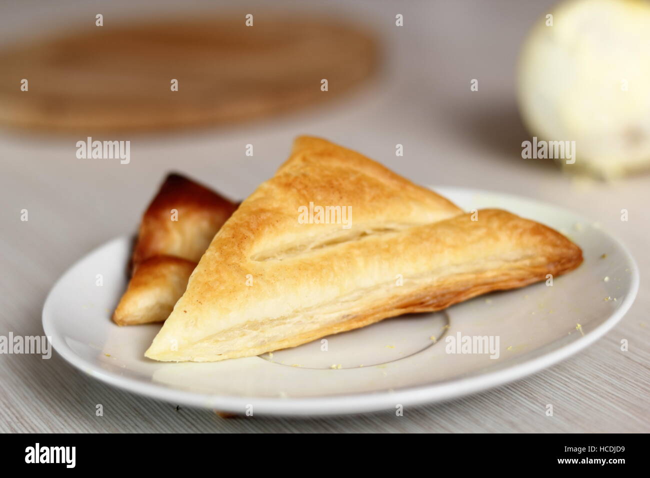 Freshly baked triangle puff pastries. Making Chicken, Cheese and Leek ...