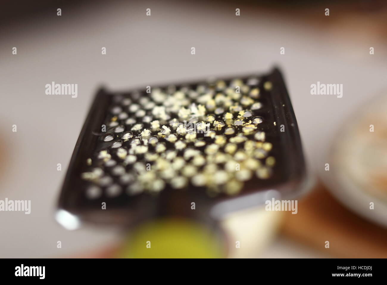 Fine grater with lemon rind. Making Chicken, Cheese and Leek Parcel ...
