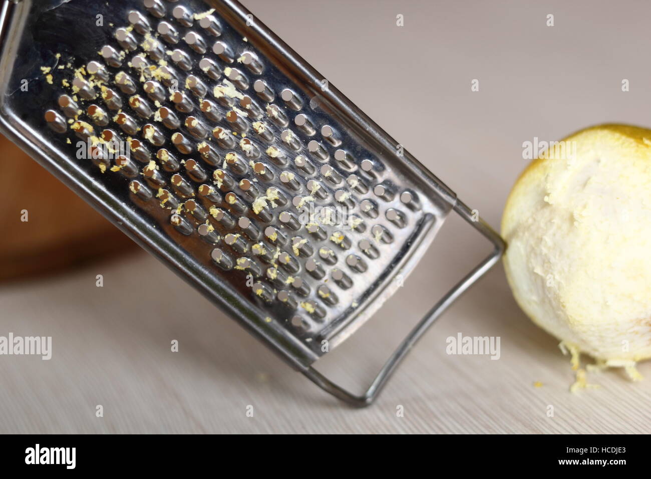 Fine grater with lemon rind. Making Chicken, Cheese and Leek Parcel ...