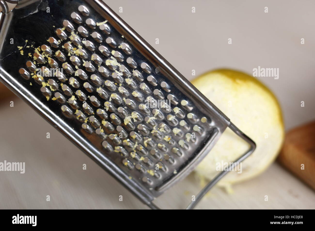 Fine grater with lemon rind. Making Chicken, Cheese and Leek Parcel ...