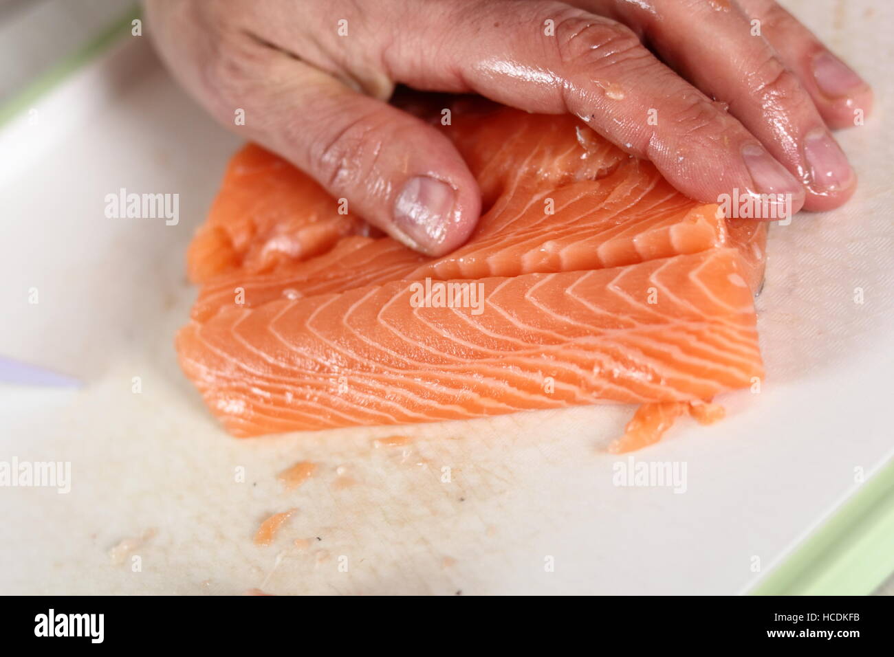 Cutting Salmon Fillet. Making Salmon in Puff Pastry Series Stock Photo ...