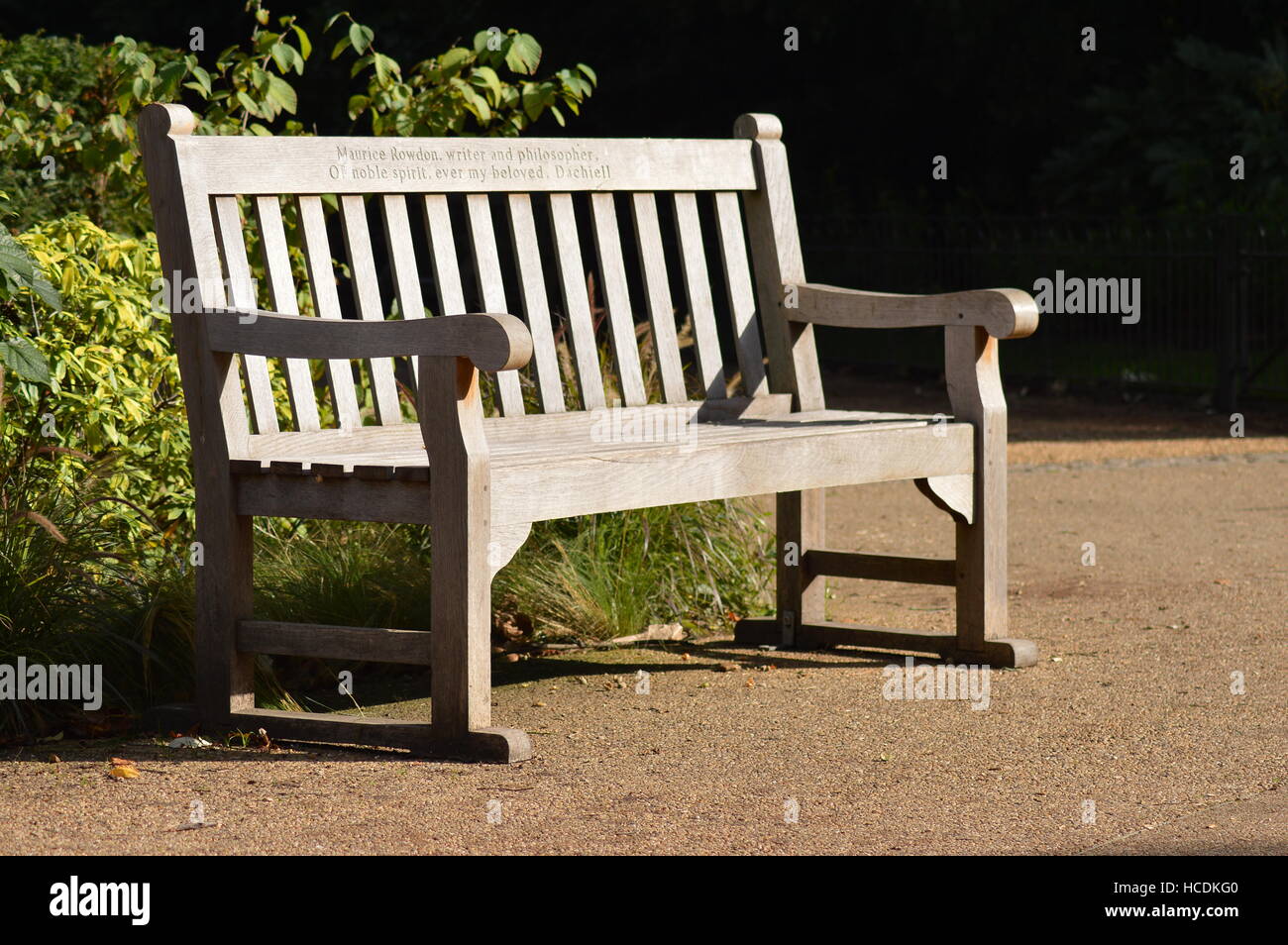 Empty park bench Stock Photo - Alamy