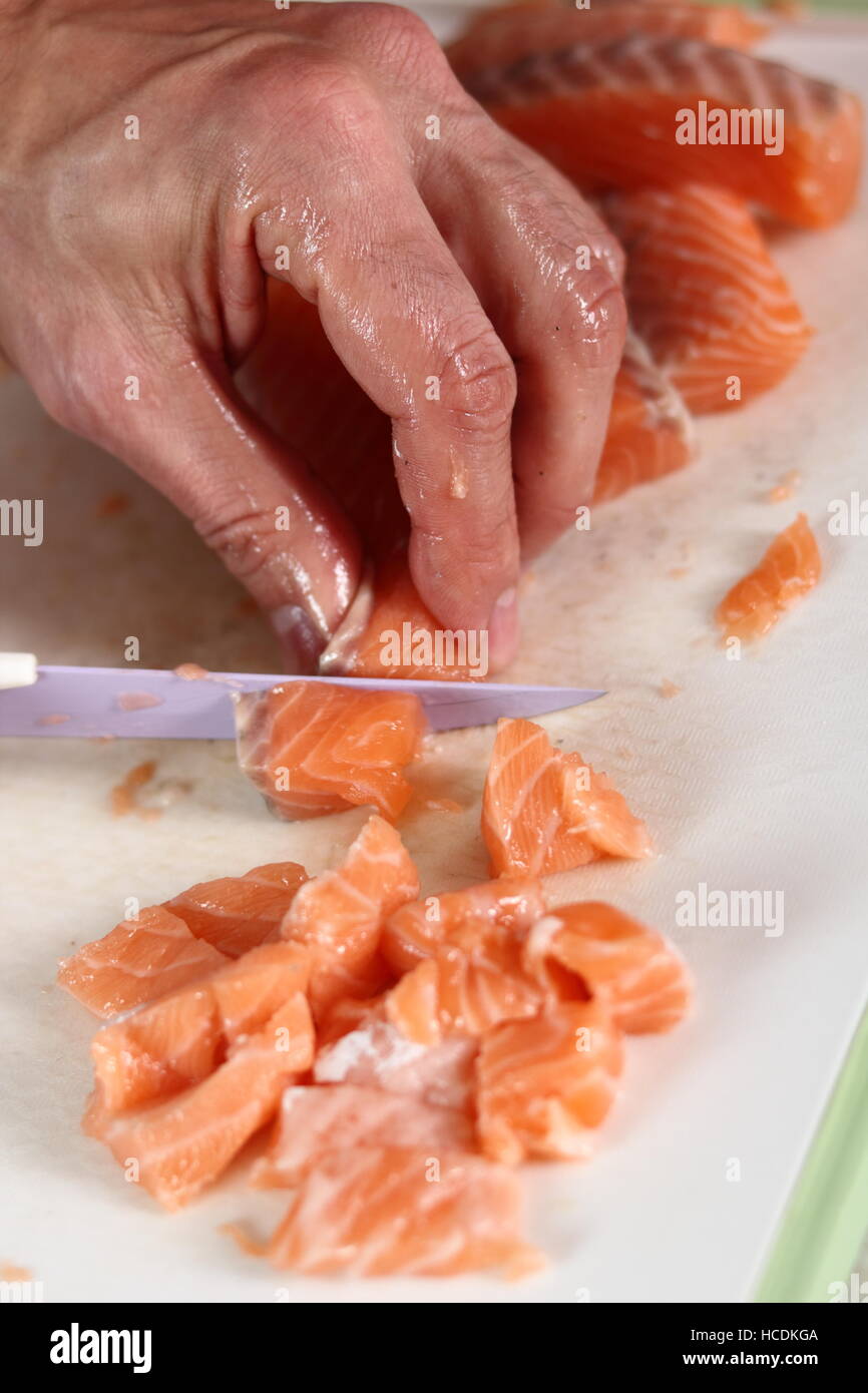Cutting Salmon Fillet. Making Salmon in Puff Pastry Series Stock Photo ...