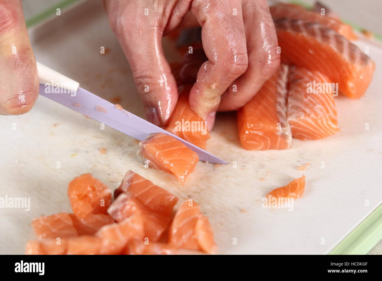 Cutting Salmon Fillet. Making Salmon in Puff Pastry Series Stock Photo ...
