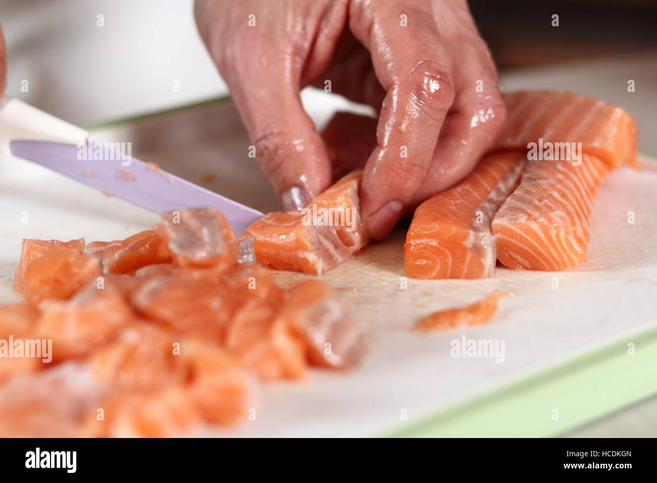 Cutting Salmon Fillet. Making Salmon in Puff Pastry Series Stock Photo ...