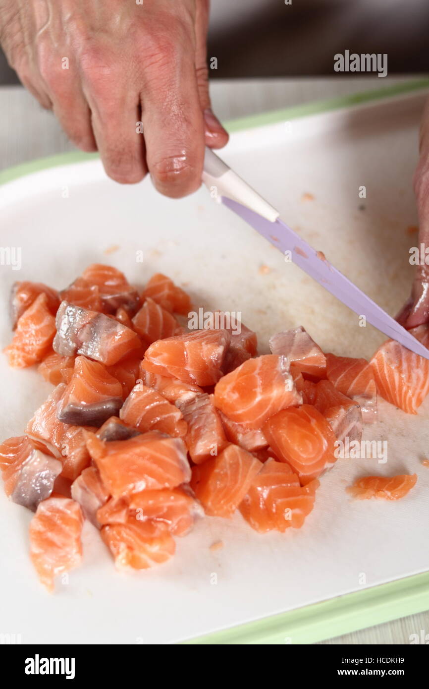 Cutting Salmon Fillet. Making Salmon in Puff Pastry Series Stock Photo ...