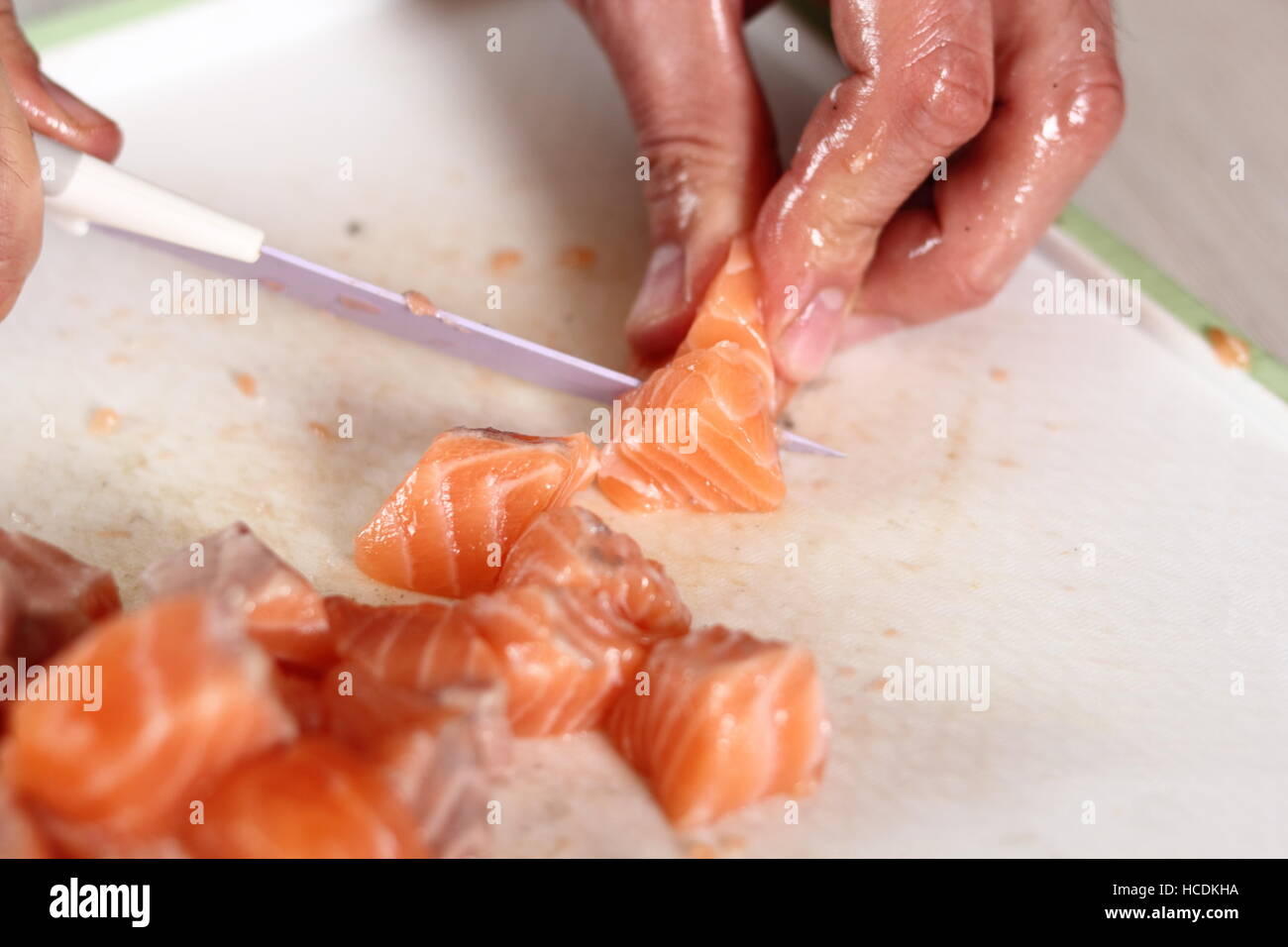 Cutting Salmon Fillet. Making Salmon in Puff Pastry Series Stock Photo ...