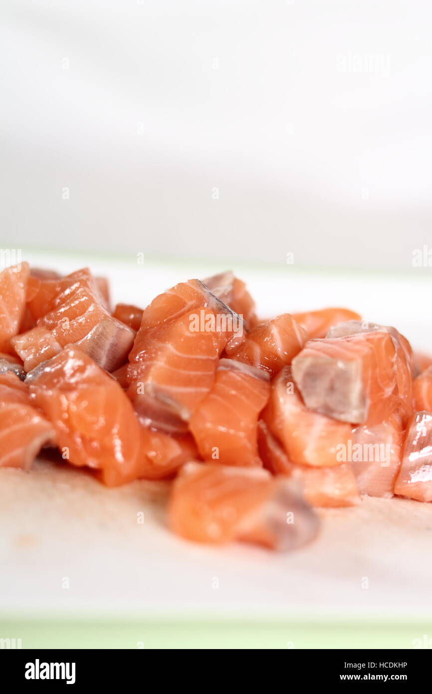 Diced salmon fillet. Making Salmon in Puff Pastry Series Stock Photo ...