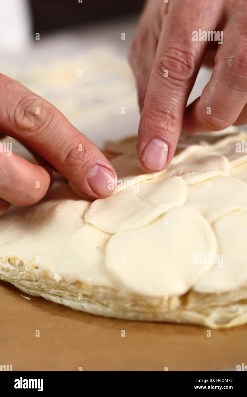 Press edges to seal. Making Salmon in Puff Pastry Series Stock Photo ...
