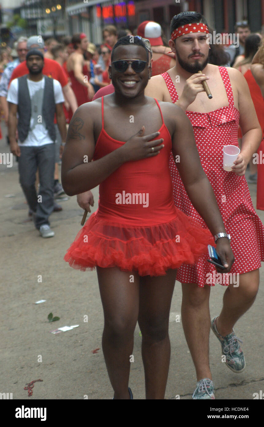 Competitors in the annual Red Dress Run on Bourbon Street in the French ...