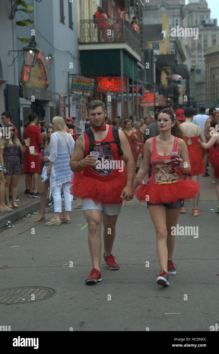 Competitors in the annual Red Dress Run on Bourbon Street in the French ...